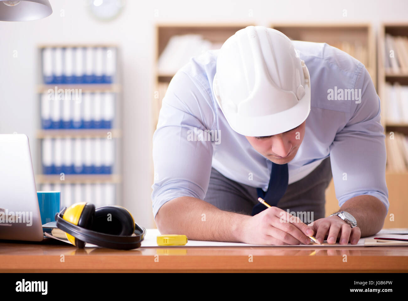 Engineer supervisor working on drawings in the office Stock Photo - Alamy