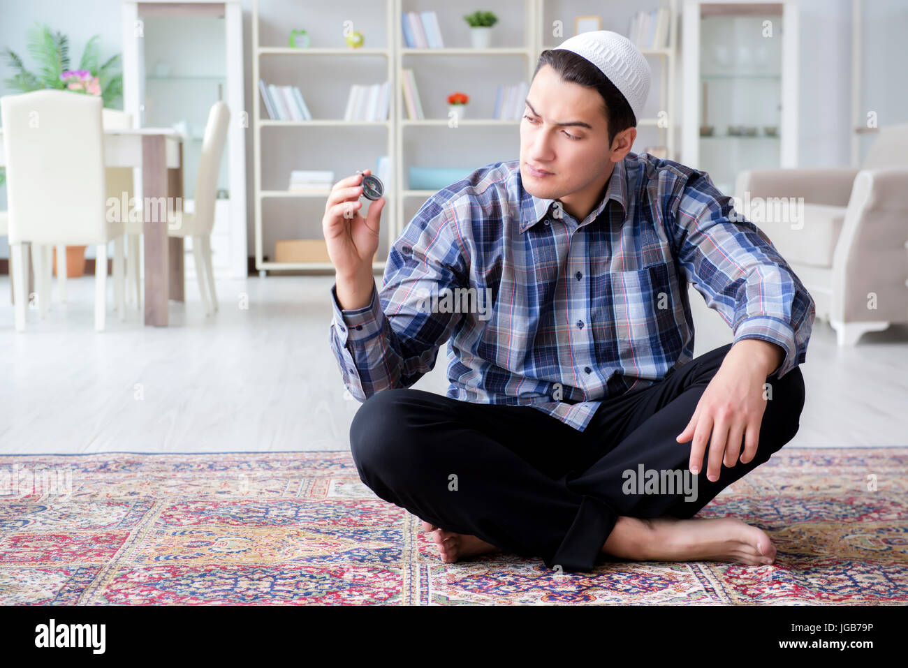 Muslim man praying at home Stock Photo - Alamy