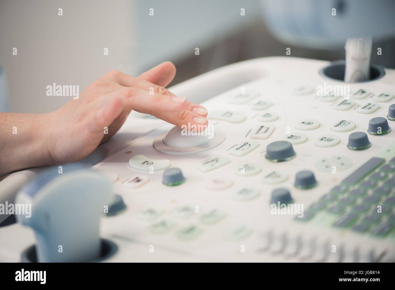 Skillful sonographer using ultrasound machine at work Stock Photo - Alamy