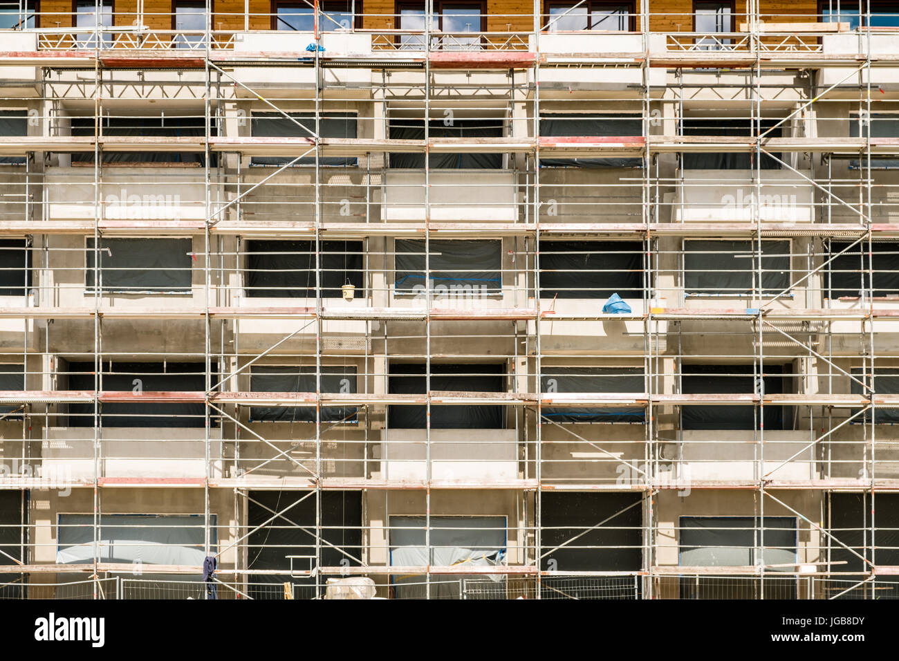 scaffolding on building facade , construction site with framework on ...