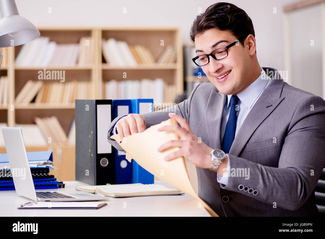 Businessman receiving letter envelope in office Stock Photo - Alamy