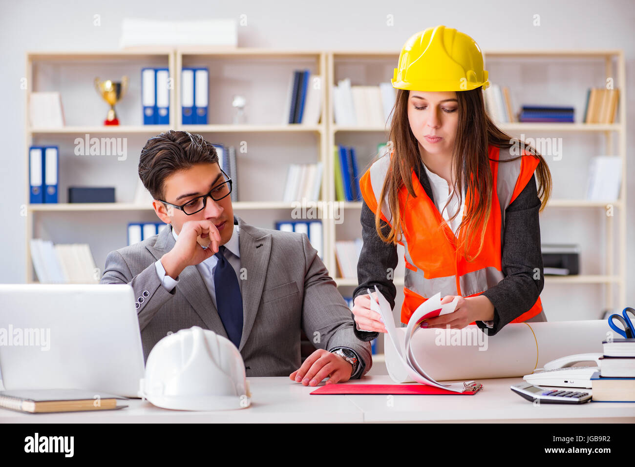 Construction foreman supervisor reviewing drawings Stock Photo - Alamy