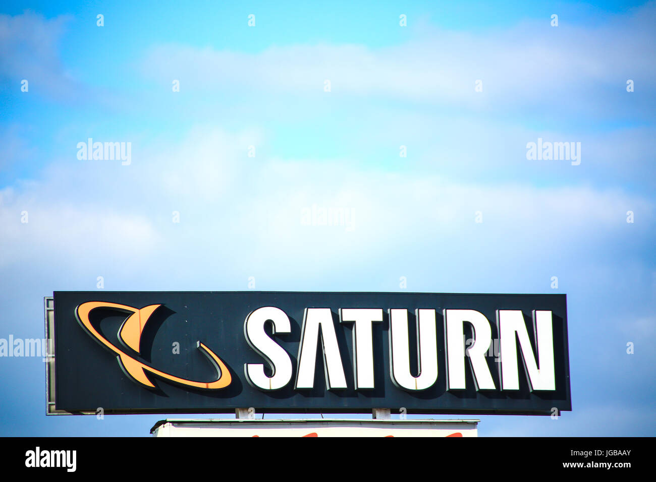 Company logos of Saturn and H&M markets Stock Photo - Alamy