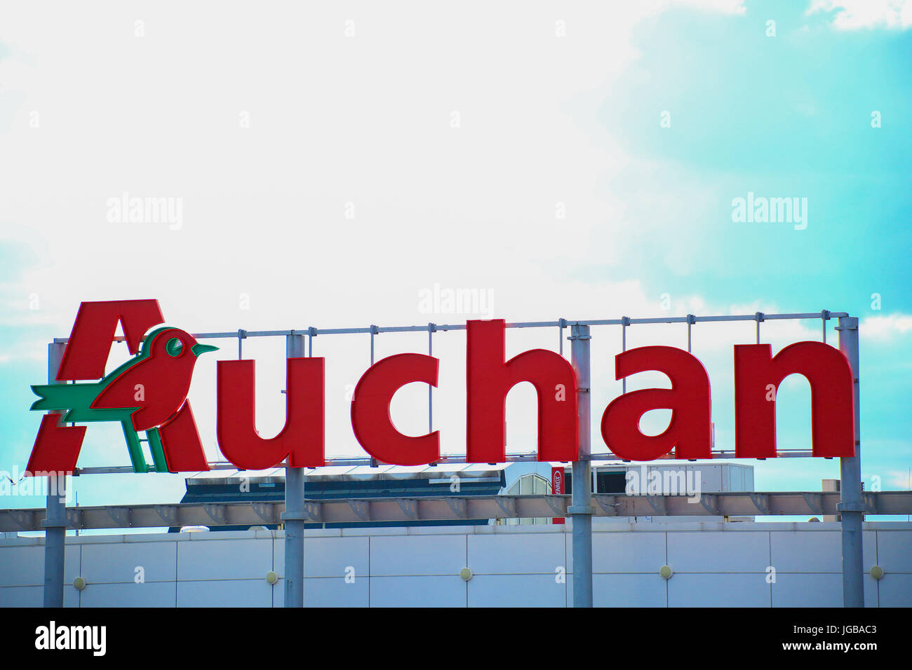 Company logo of Auchan Stock Photo - Alamy