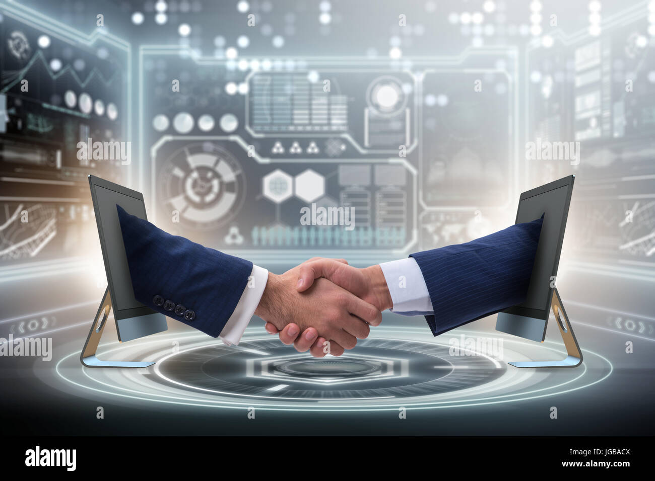 Two hands from screen in handshake concept Stock Photo - Alamy