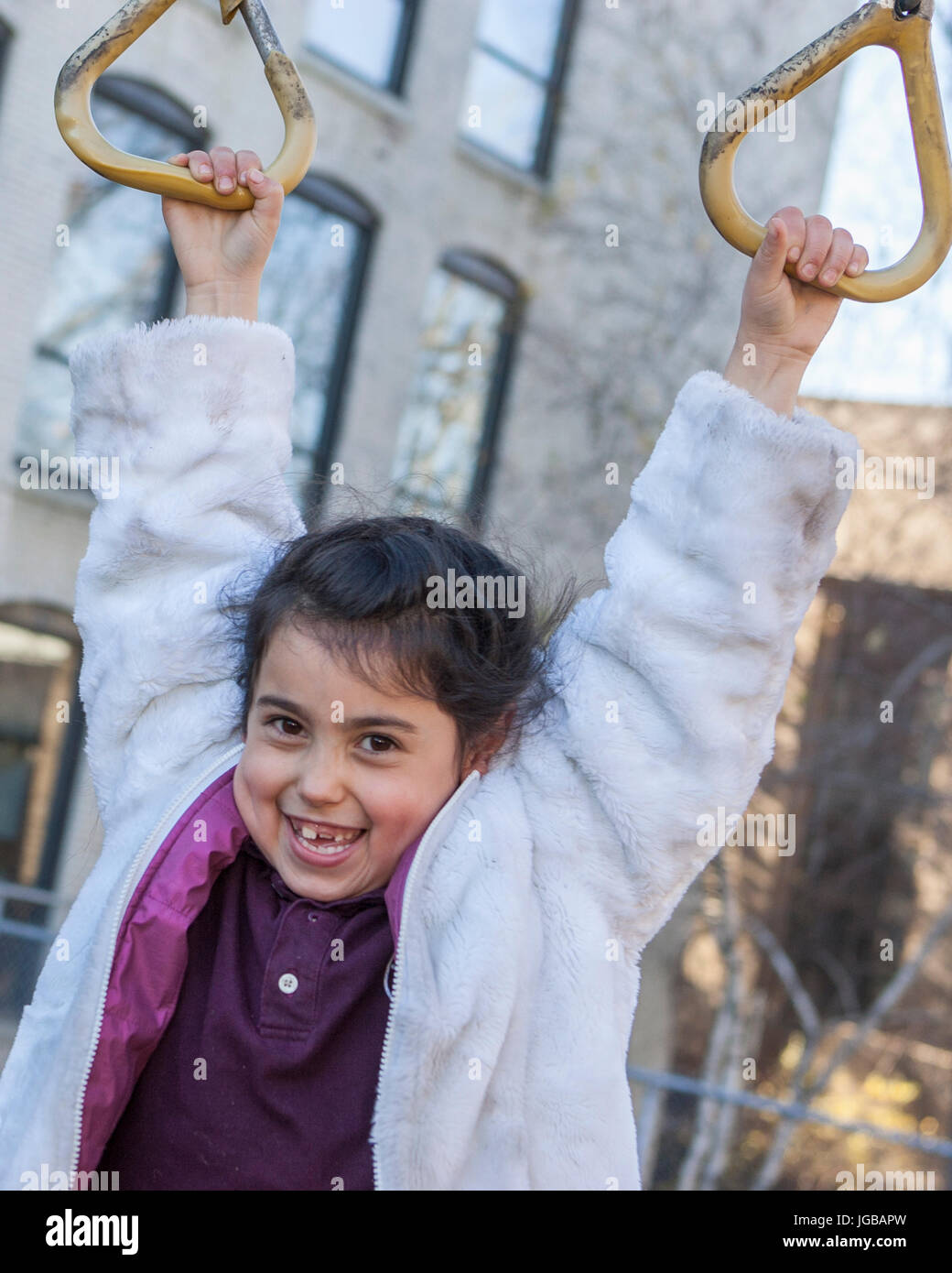 Kids playing outside at recess on the swing Stock Photo - Alamy