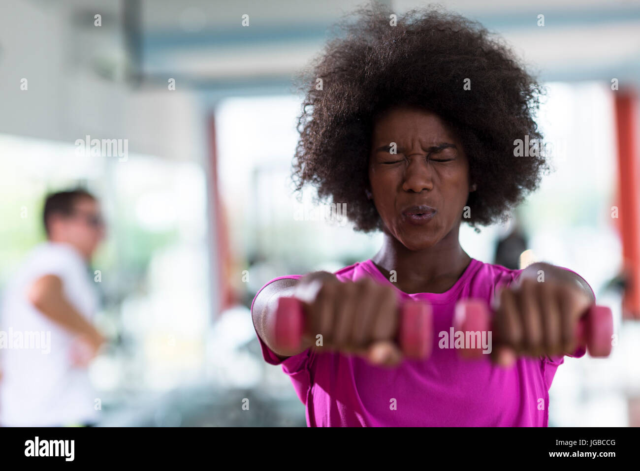happy healthy african american woman working out in a crossfit gym on ...