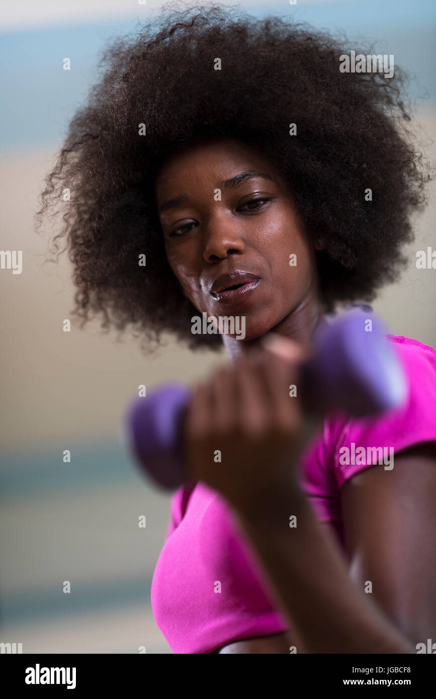 happy healthy african american woman working out in a crossfit gym on ...