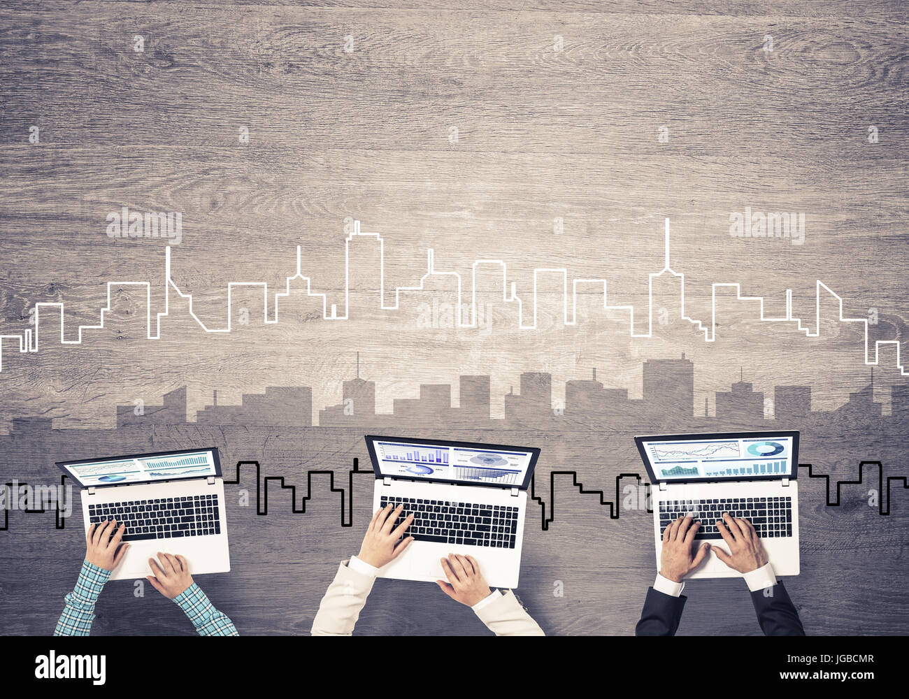 Group of three people with devices in hands working together as symbol ...