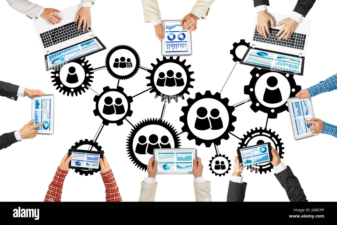Group of people with devices in hands working together as symbol of ...