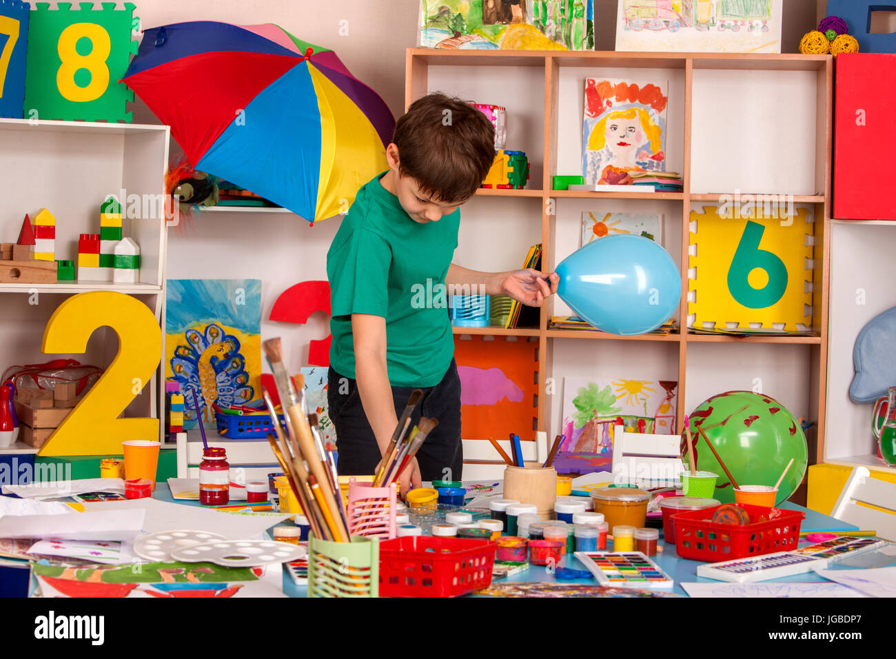 Small students boy painting in art school class Stock Photo - Alamy