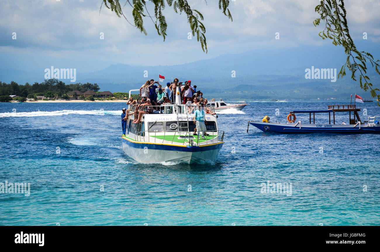 Bali, Indonesia - Apr 19, 2016. Tourists on the ferry in Bali Island ...