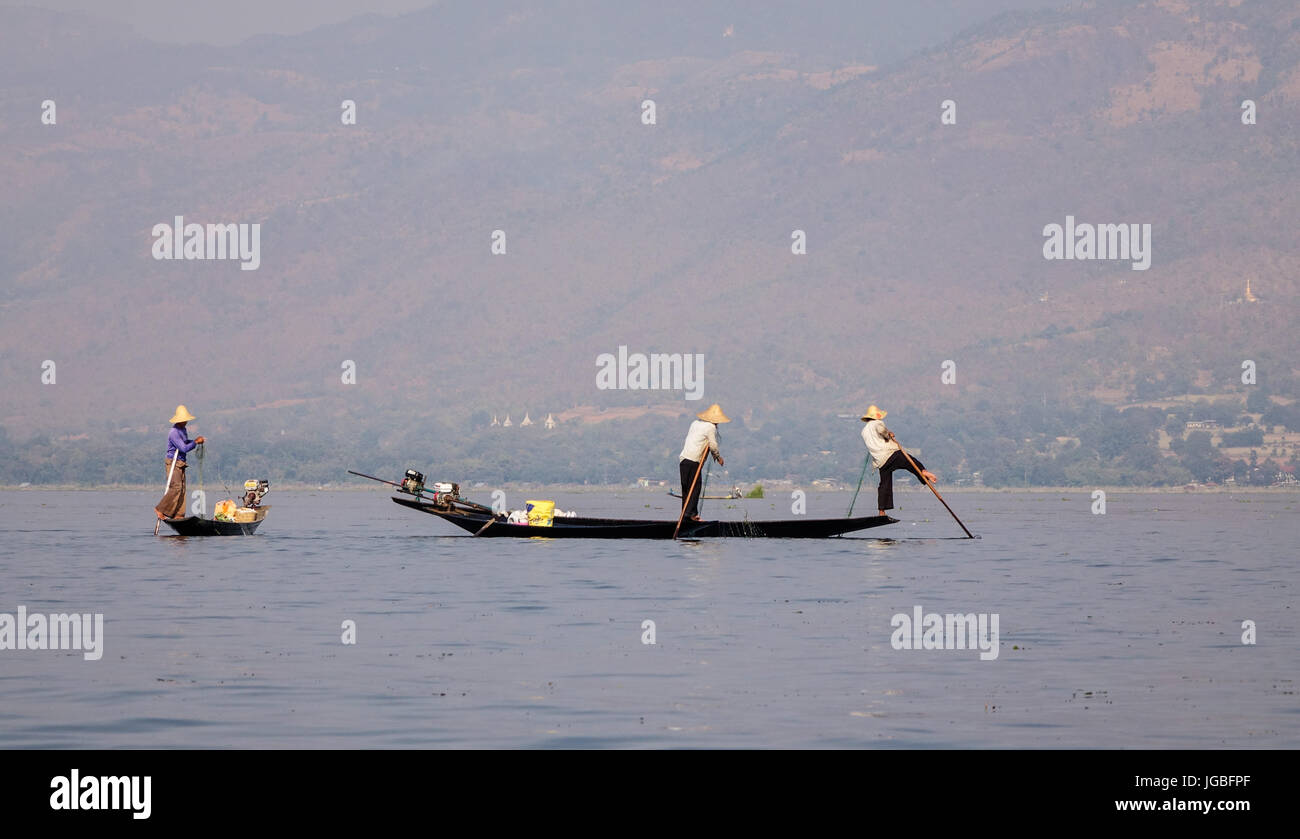 Burmese people with the boats on Inle lake in Myanmar. Inle is the ...