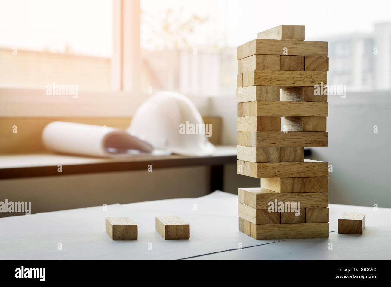 the blocks wood tower game with architectural engineer plans or blue ...