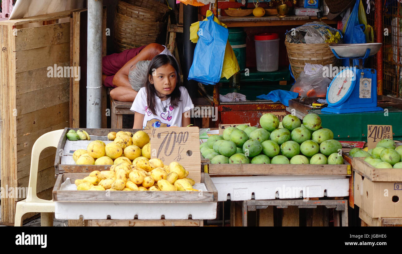 Philippines poverty woman young market hi-res stock photography and ...
