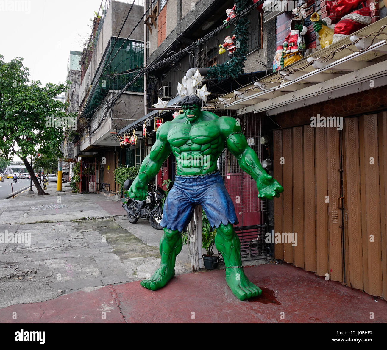 Manila, Philippines - Dec 20, 2015. Superhero statue at slum region in ...