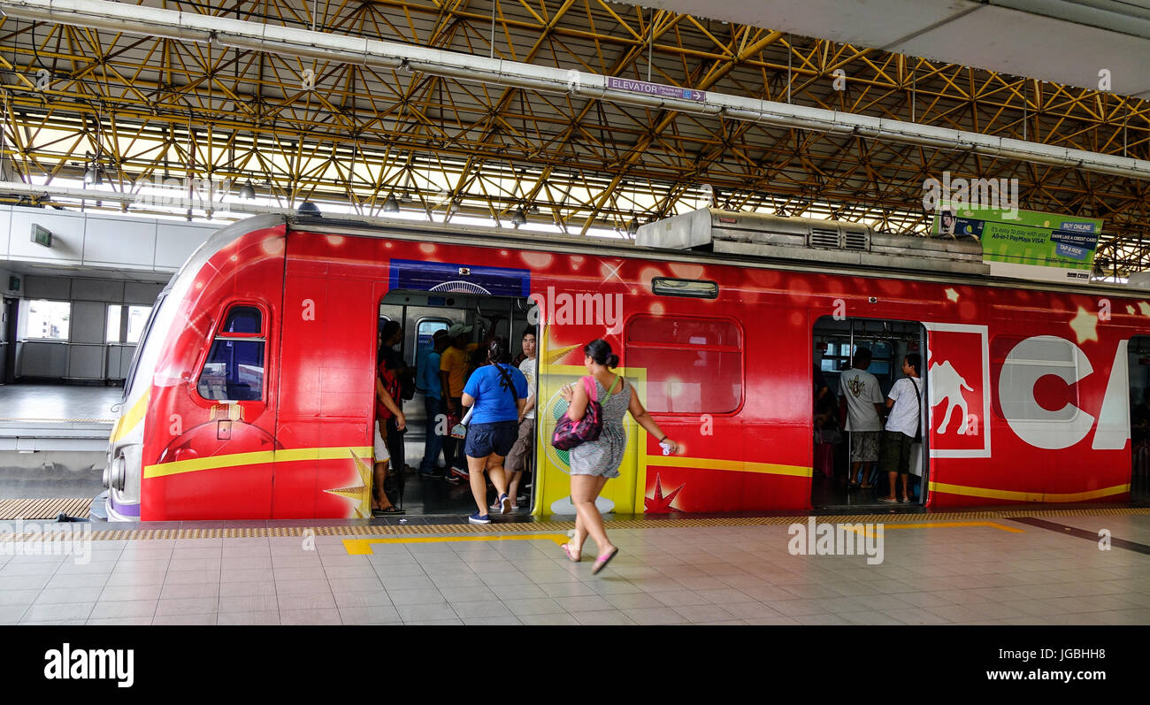 Manila, Philippines - Dec 20, 2015. People coming to LRT train at EDSA ...