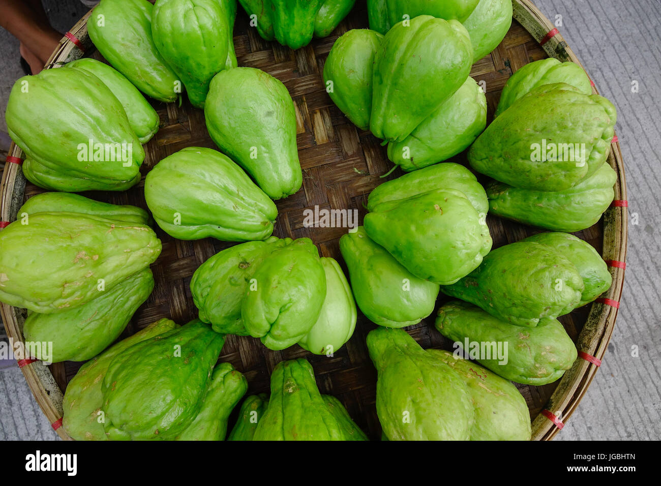 Close-up of green chayote fruits at the local market in Asia Stock ...
