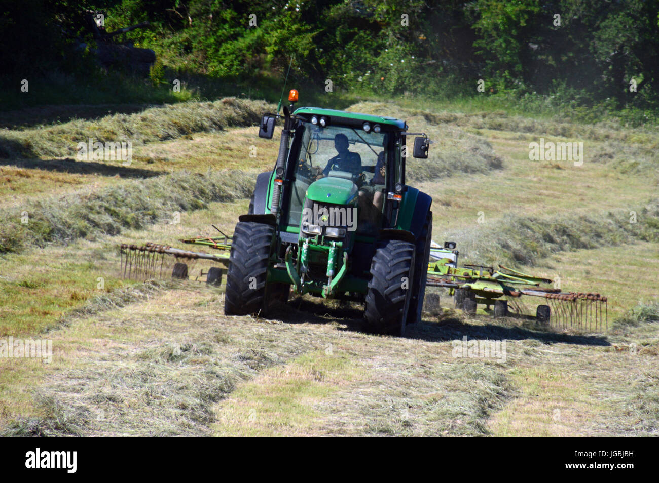 Tractor turning hay hi-res stock photography and images - Alamy