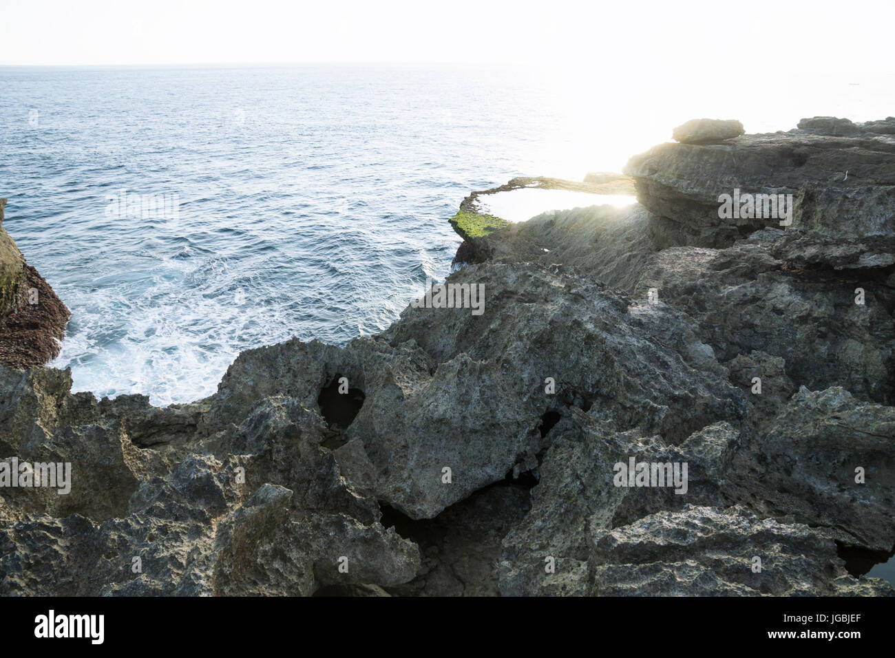 Natural Pool with sunlight at devil's tears cliff Nusa Lembongan, Bali ...