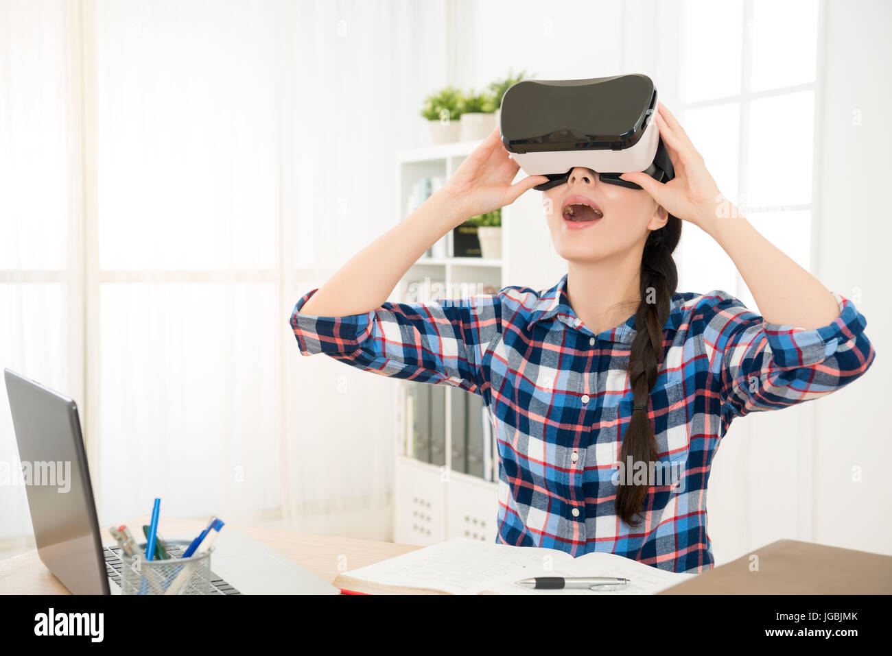 young girl use cool virtual reality glasses for online gaming ...