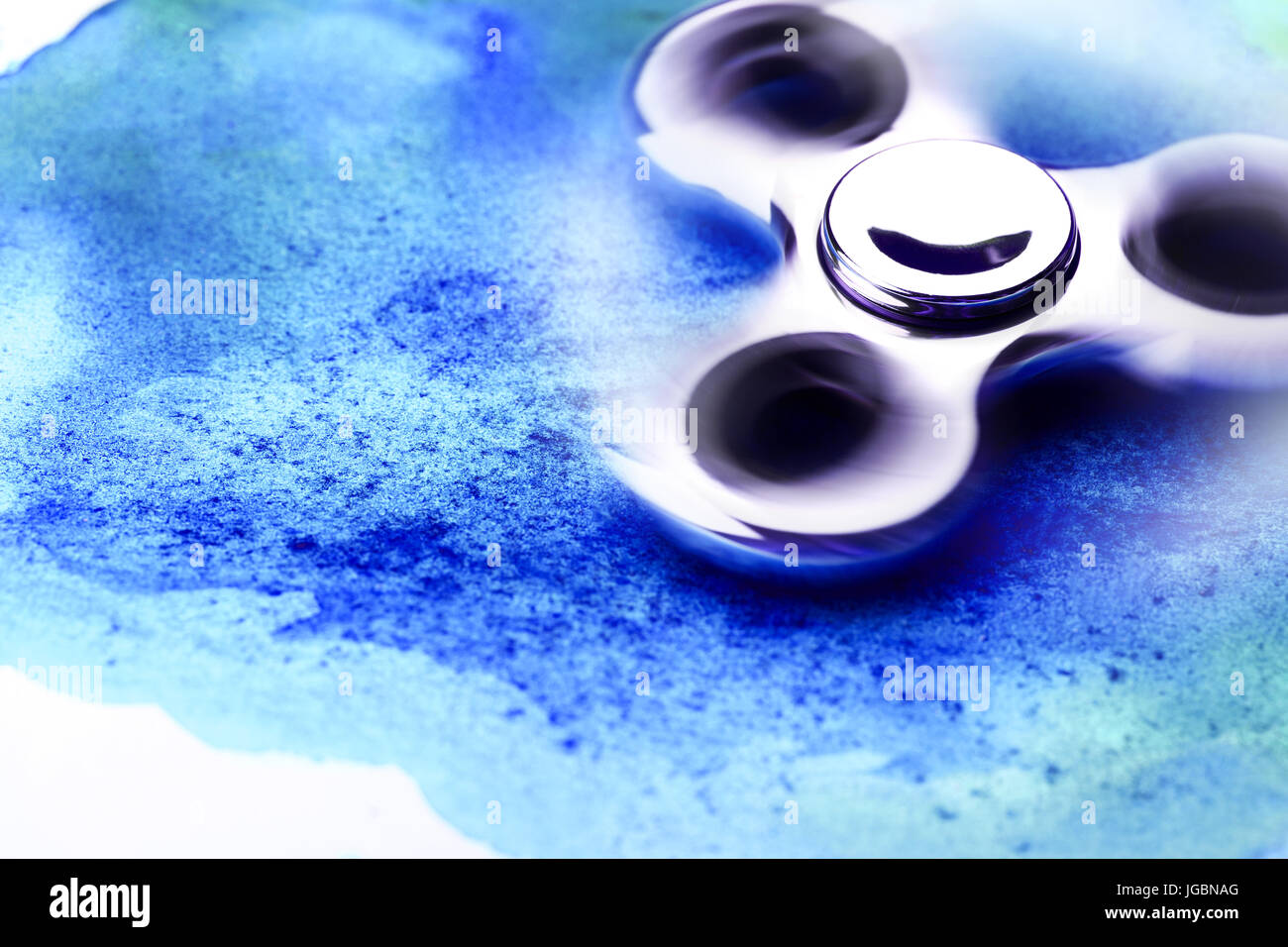 Beautiful spinner on watercolor background Stock Photo - Alamy