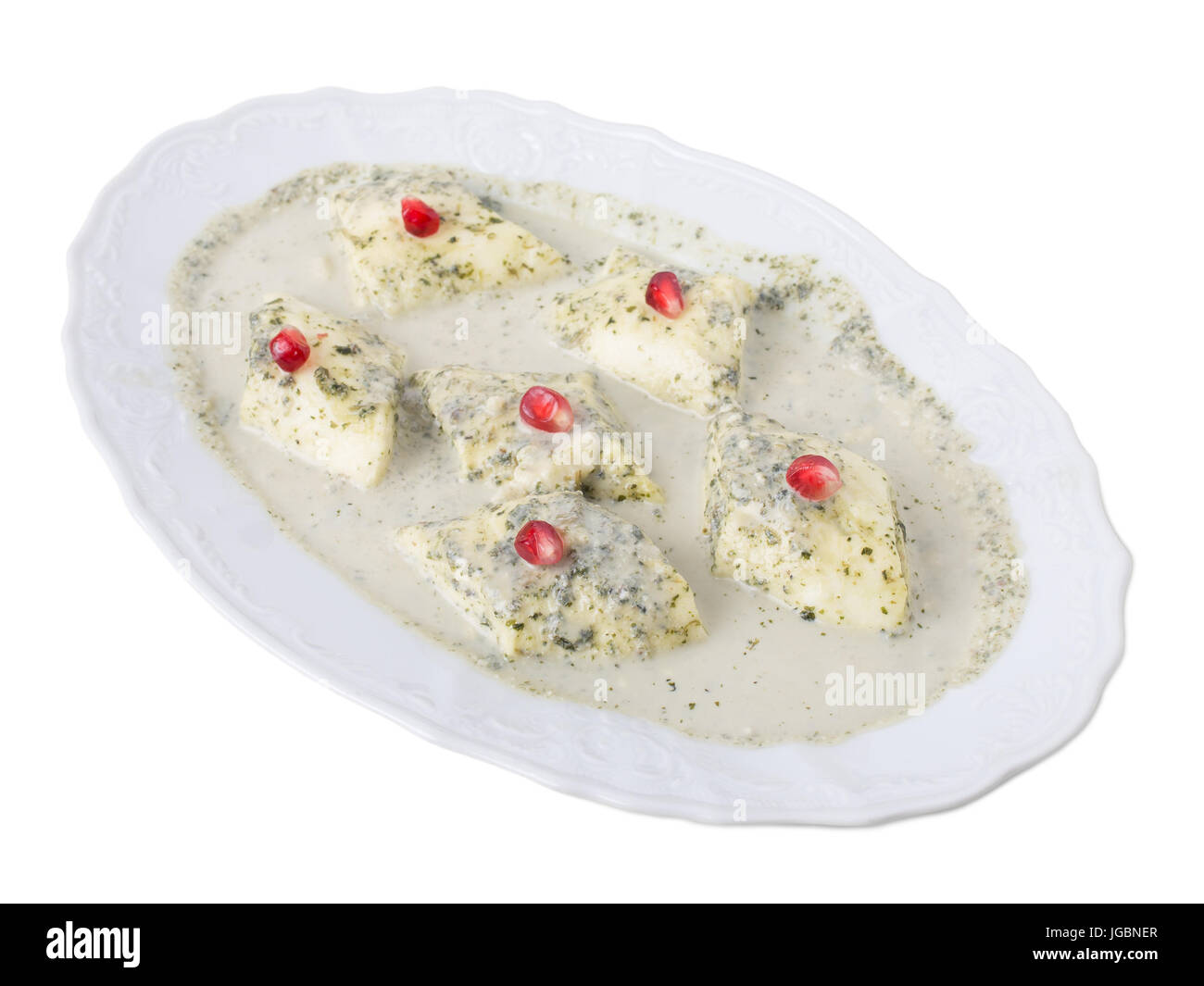 Georgian homemade soft cheese rolls in milk sauce. Isolated on a white ...