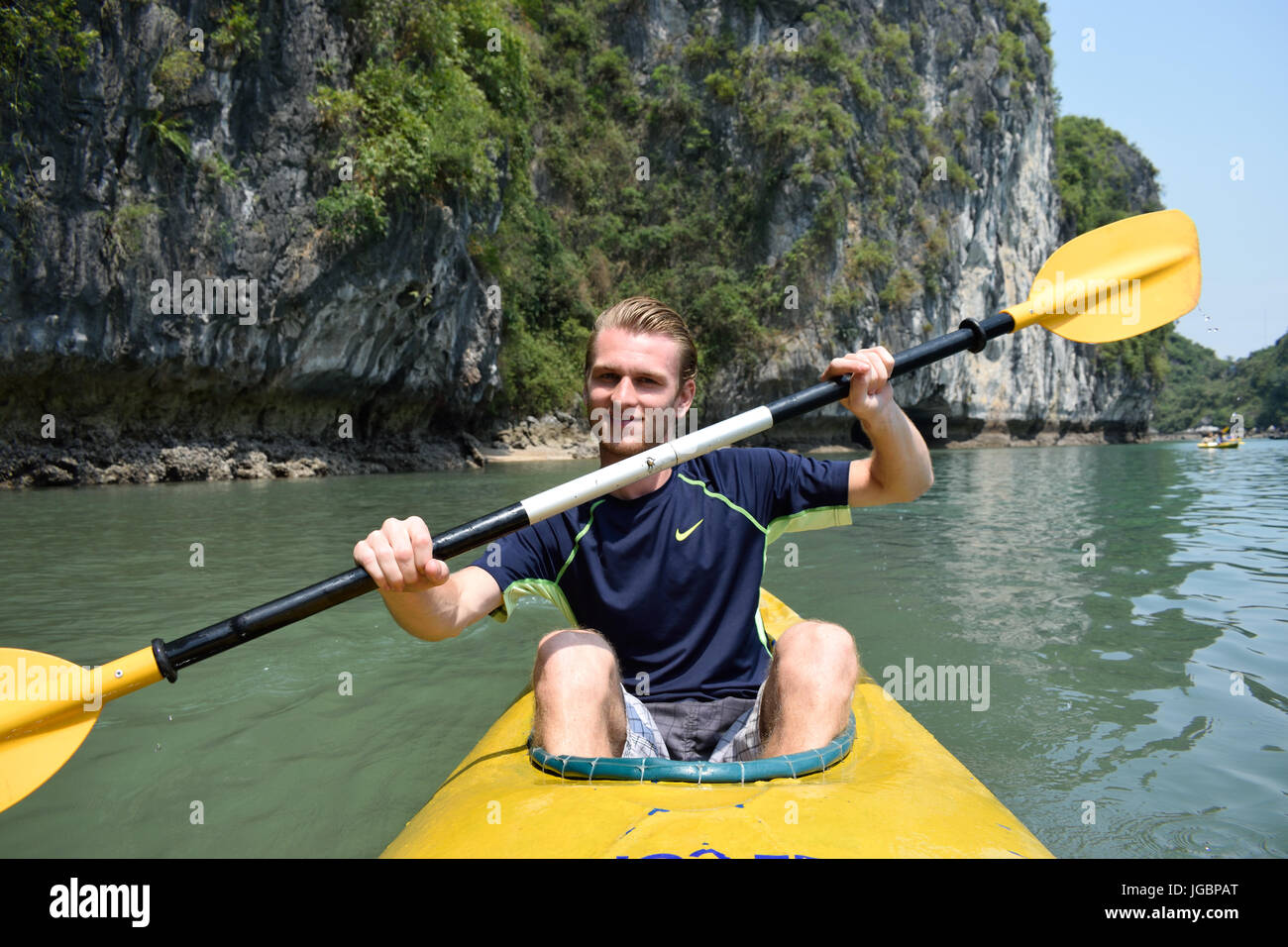Kayaking in Ha long bay Stock Photo - Alamy