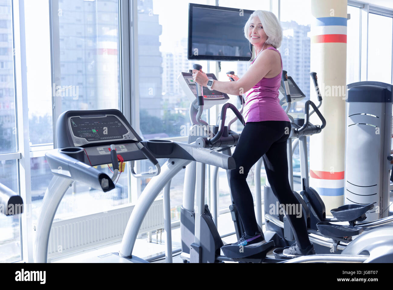 Happy senior lady doing cardio training Stock Photo - Alamy