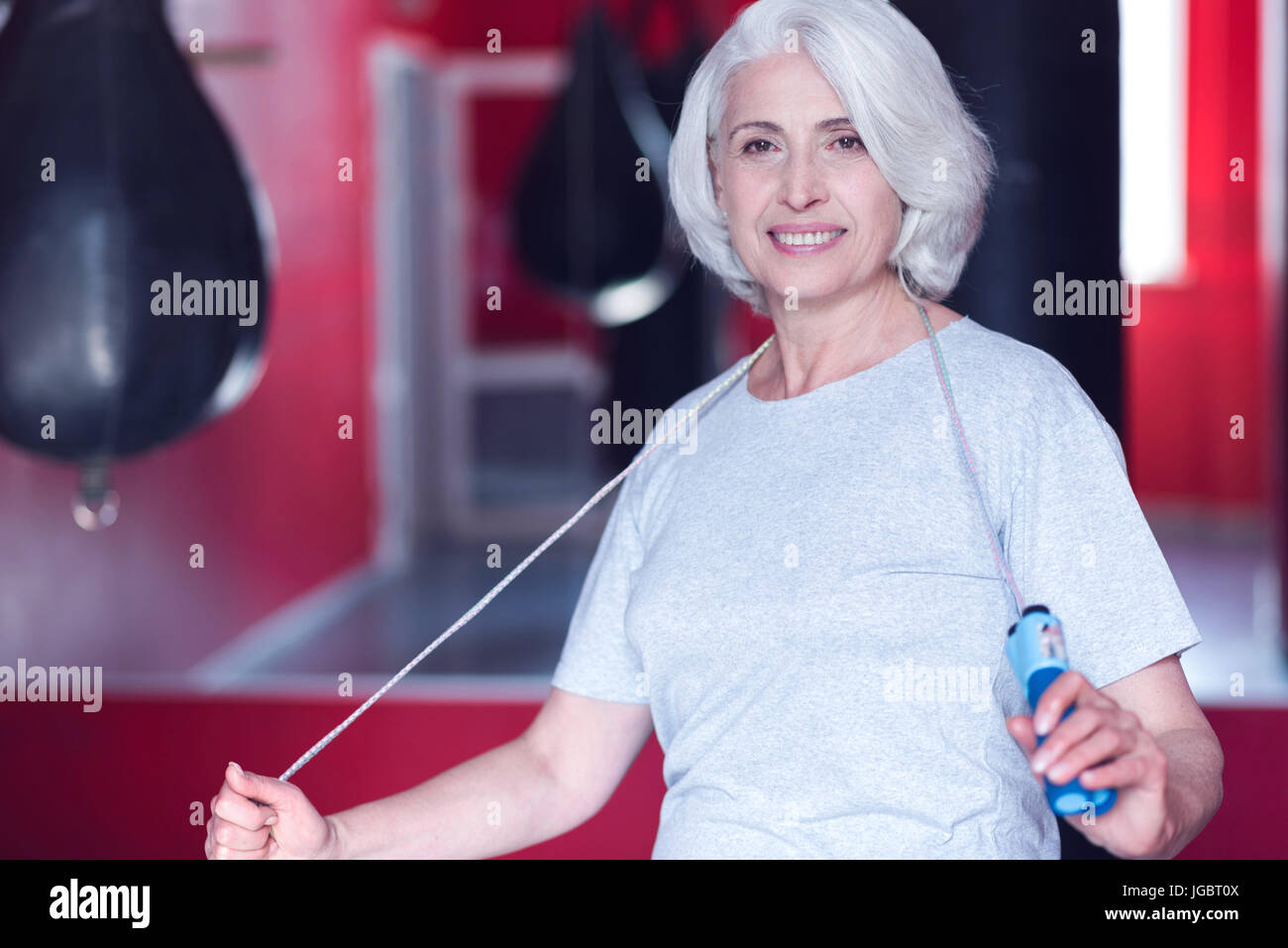 Nice senior lady standing with skipping rope Stock Photo - Alamy