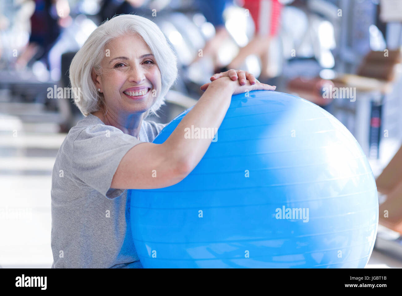 Woman hugging exercise ball hi-res stock photography and images - Alamy