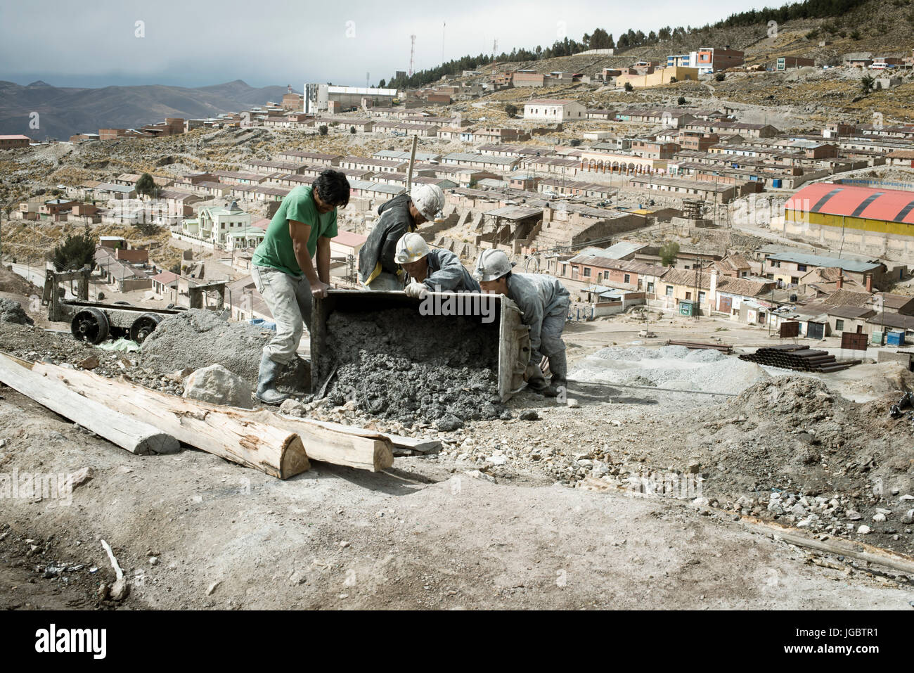 Miners emptying mine cart at Cerro Rico silver mine in Potosi. October ...