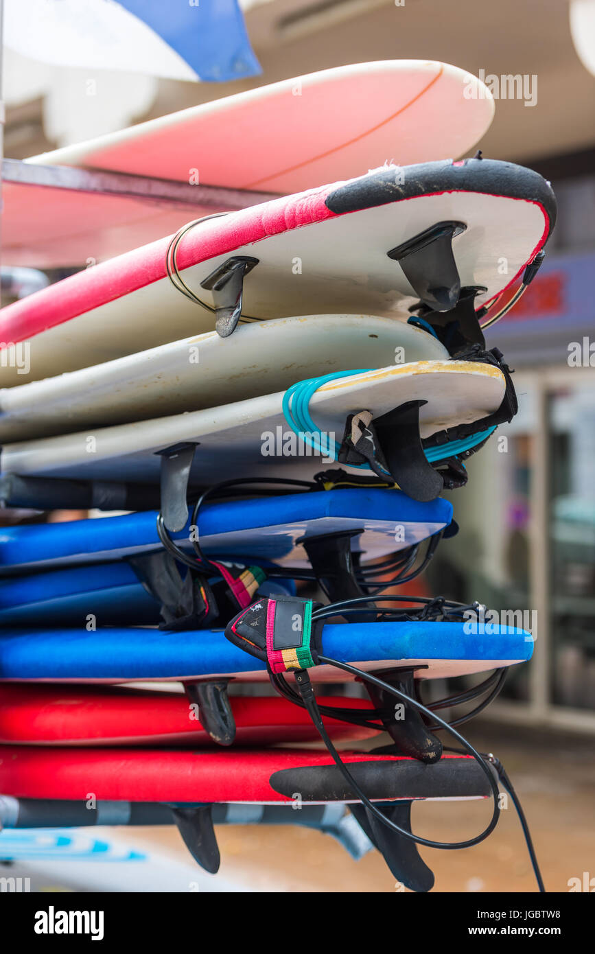 set of different color surf boards in a stack. France Stock Photo - Alamy