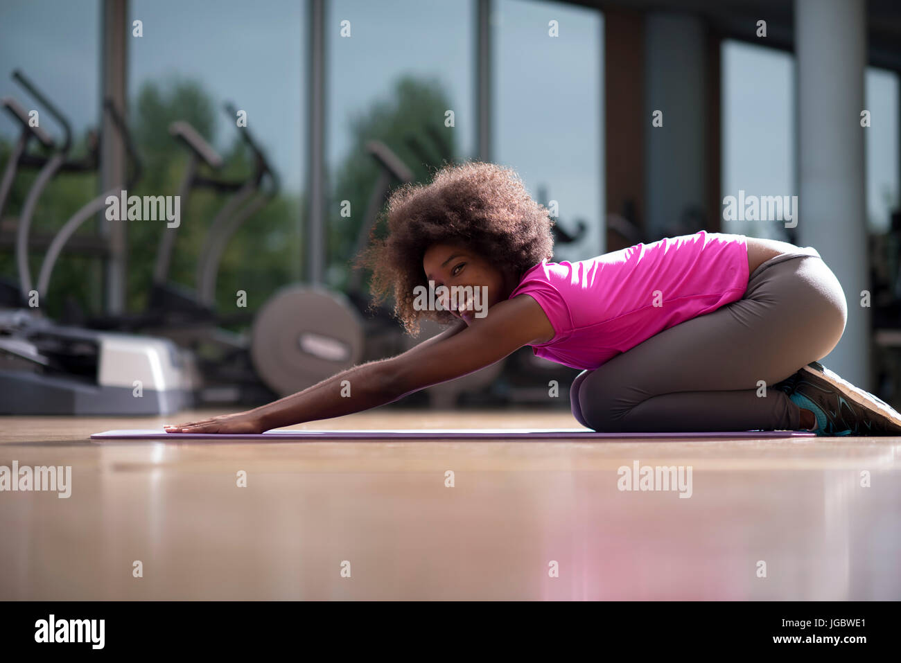 beautiful young african american woman exercise yoga in gym Stock Photo ...