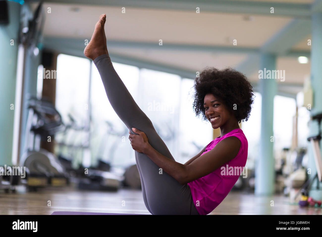 beautiful young african american woman exercise yoga in gym Stock Photo ...