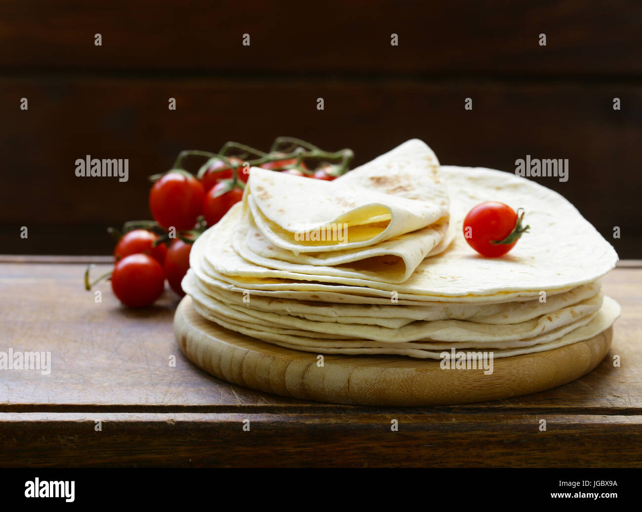 Flat bread tortillas pile on the table Stock Photo - Alamy