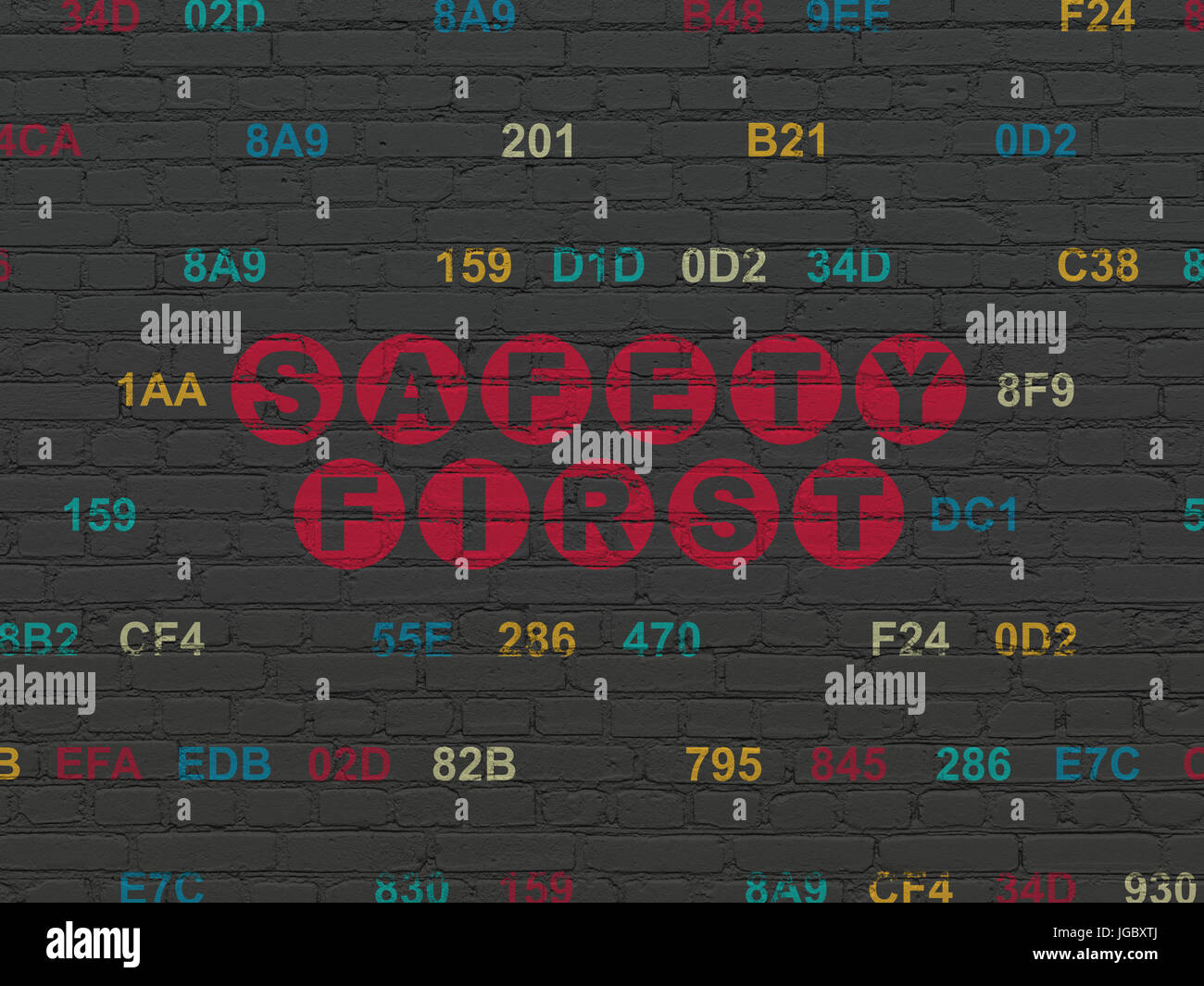 Safety concept: Safety First on wall background Stock Photo - Alamy
