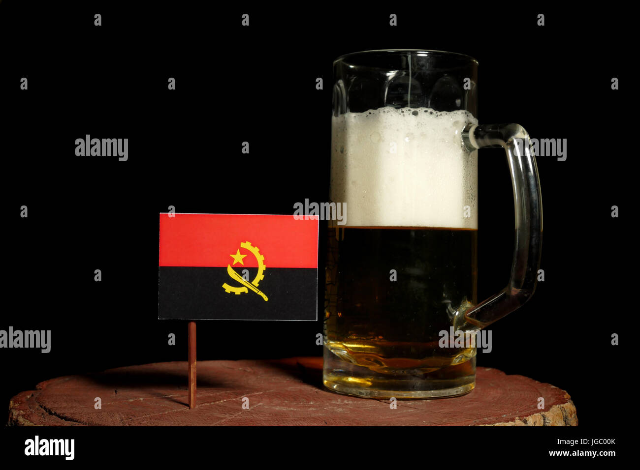 Angolan flag with beer mug isolated on black background Stock Photo - Alamy