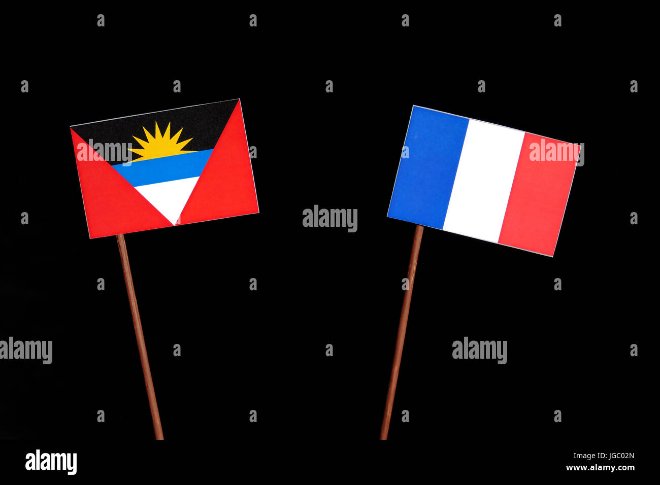 Antigua and Barbuda flag with French flag isolated on black background ...