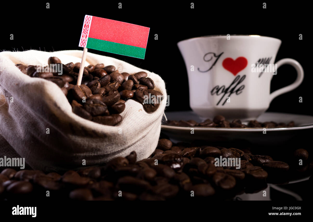 Belarus flag in a bag with coffee beans isolated on black background ...