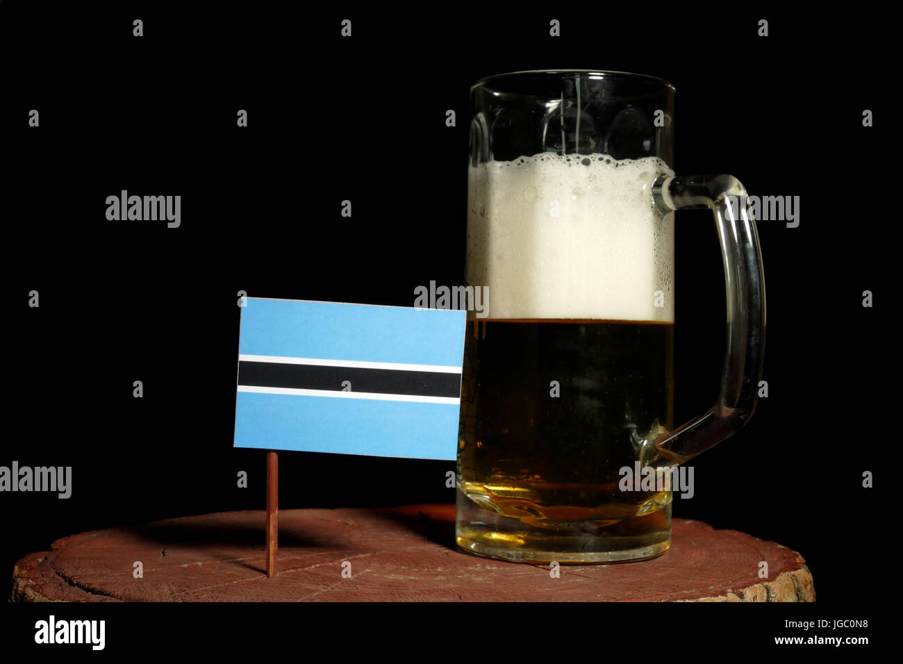 Botswana flag with beer mug isolated on black background Stock Photo ...