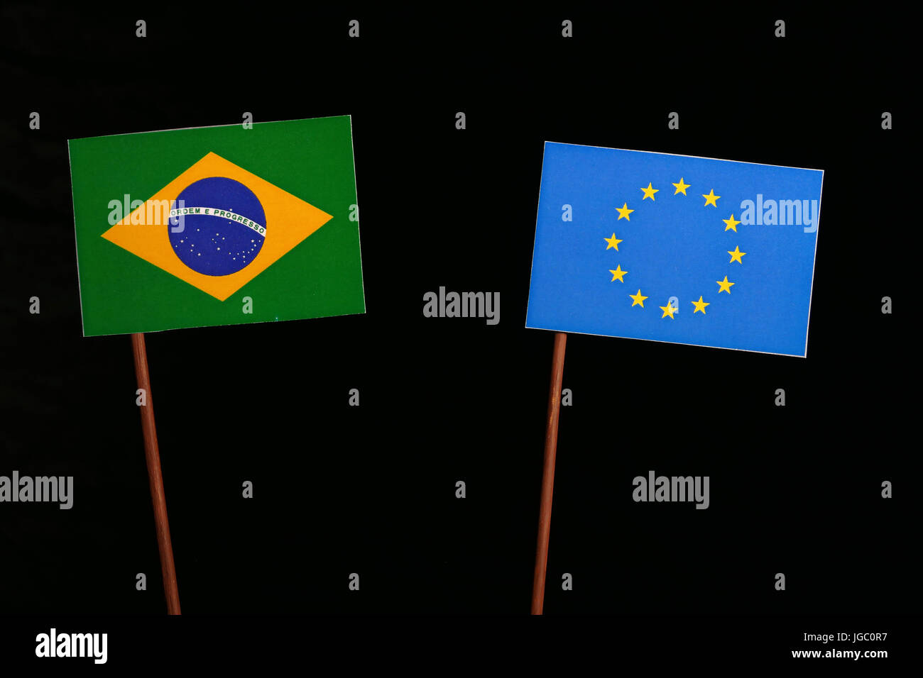 Brazilian flag with European Union (EU) flag isolated on black ...