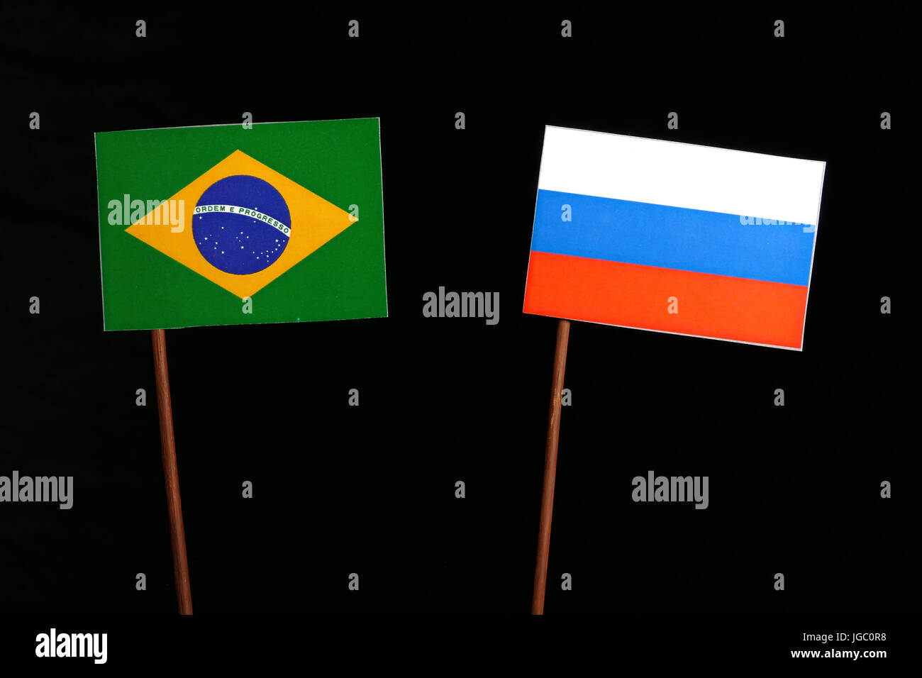 Brazilian flag with Russian flag isolated on black background Stock ...