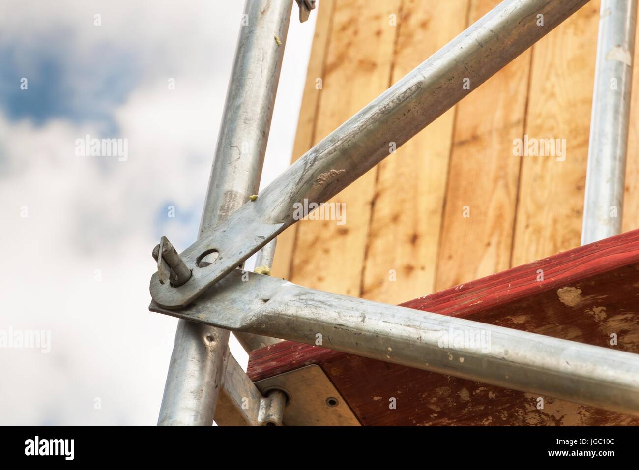 Detail of scaffolding joints at the building of a family house. Work on ...