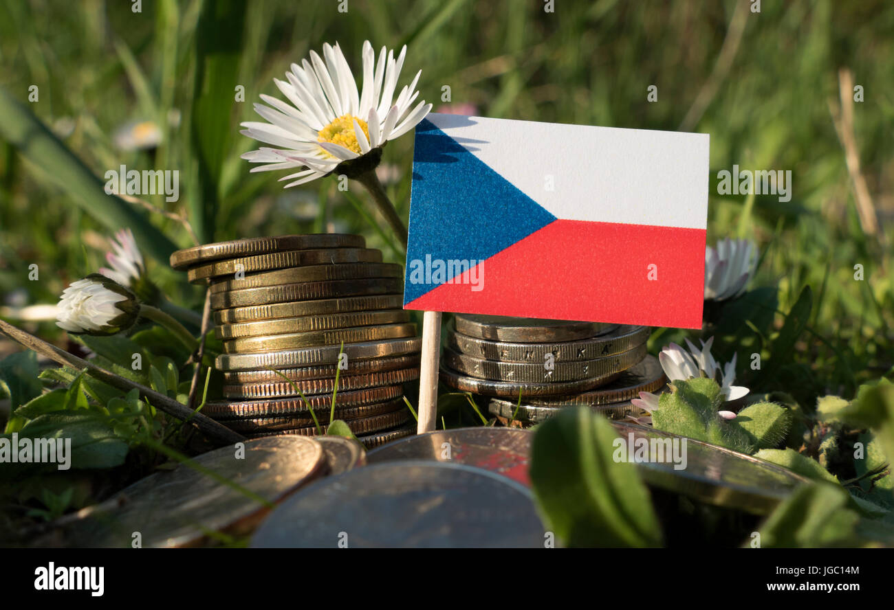 Czech flag with stack of money coins with grass and flowers Stock Photo ...