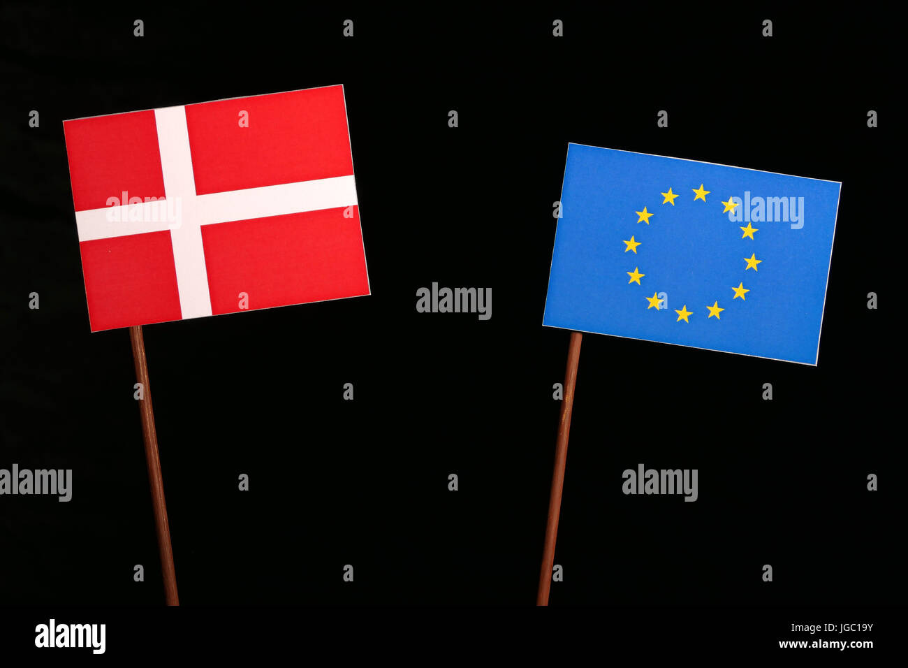 Danish flag with European Union (EU) flag isolated on black background ...