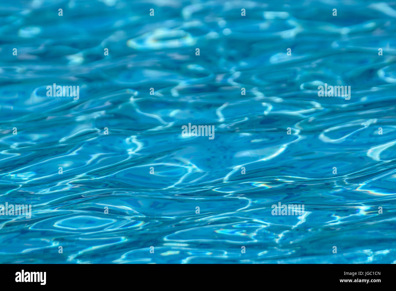 swimming pool blue water detail in summer time Stock Photo - Alamy
