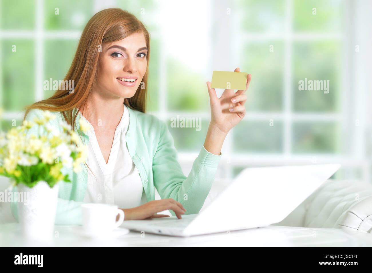 Beautiful young girl with a laptop Stock Photo - Alamy