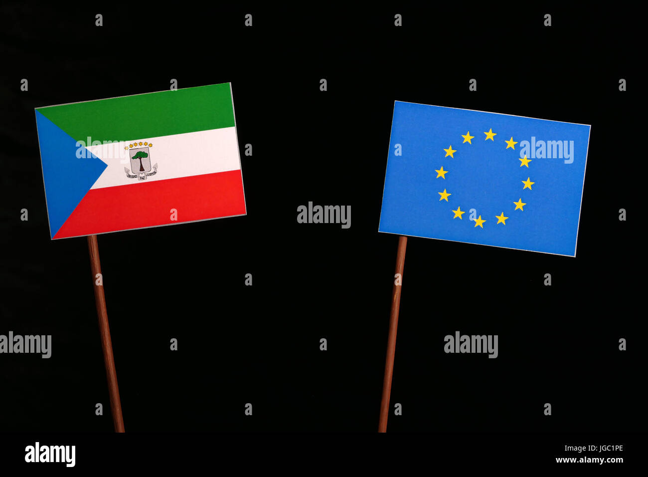 Equatorial Guinea flag with European Union (EU) flag isolated on black ...
