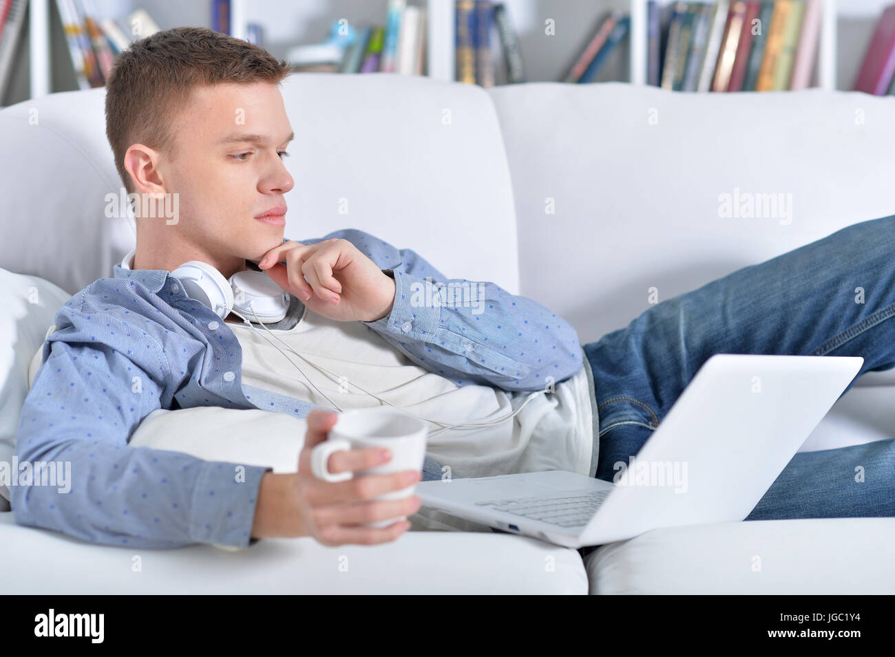 handsome young man with laptop Stock Photo - Alamy